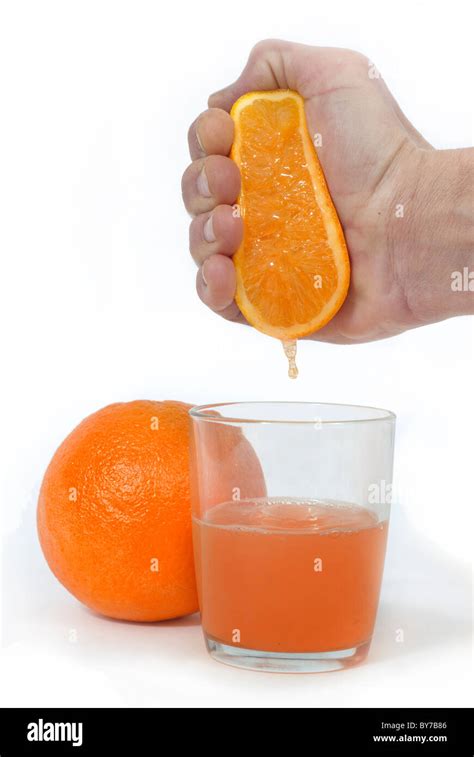 Squeezing orange juice Stock Photo - Alamy