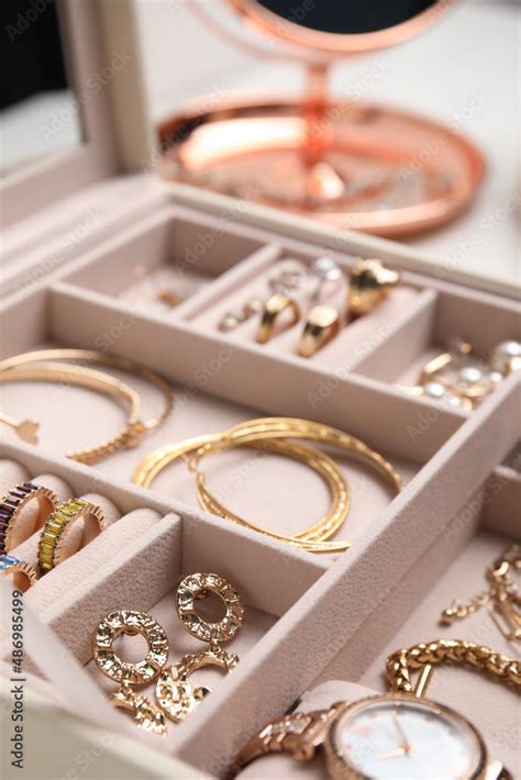 Jewelry box with stylish golden bijouterie, closeup view Stock Photo ...