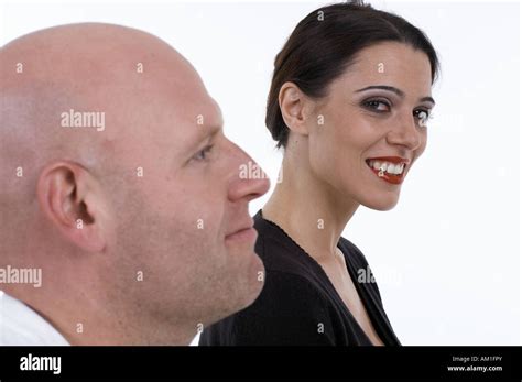 Woman looks coquettish to man Stock Photo - Alamy