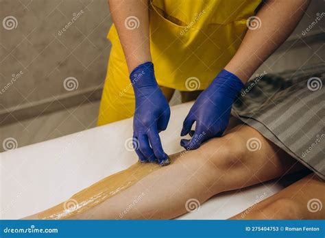 Beautician Waxing Female Legs in Spa Center Stock Image - Image of ...