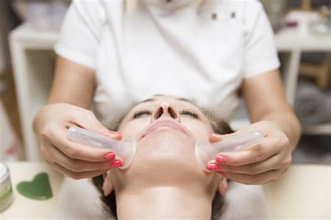 Cup Applied To Facial Skin of a Female Patient As Part of the ...