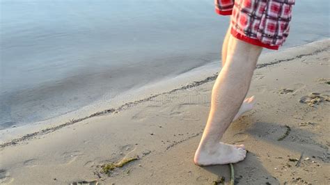 Bare Feet of Young Man Standing on Beach Full of Seashells Stock Video ...