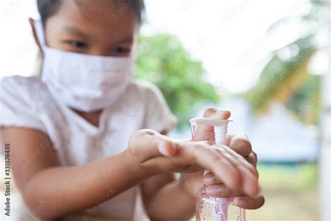 Asian child girl wearing protection mask for protect air smog pollution ...