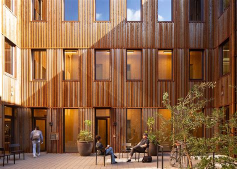 all-wood mass timber building in portland, oregon is wrapped in a steel ...