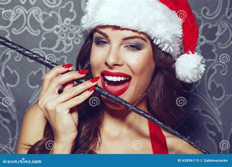 Сексуальная женщина Santa с годом сбора винограда хлыста Стоковое ...