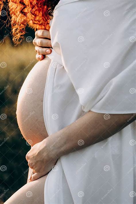 Pregnant Girl Holding Her Belly. Stock Image - Image of caucasian, hand: 285251403