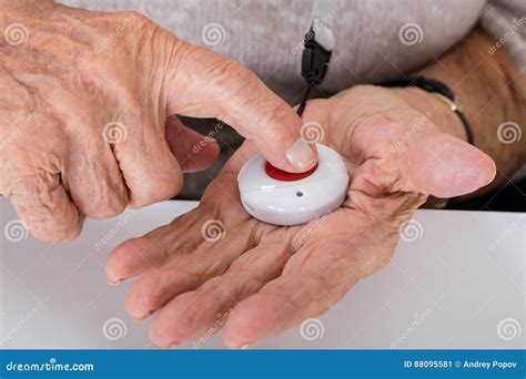 Senior Woman Pressing Alarm Button Stock Image - Image of pensioner ...