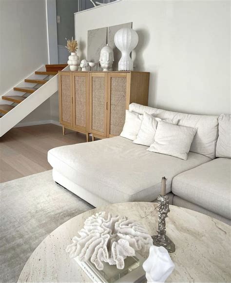 a living room filled with furniture and a white couch in front of a ...
