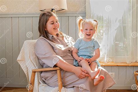 Mother Plays with Her Little Daughter and Tickles Her Bare Feet Stock Image - Image of children ...