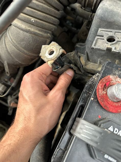 Wanted to replace battery terminals, but found this once I undid the positive side, do i take ...