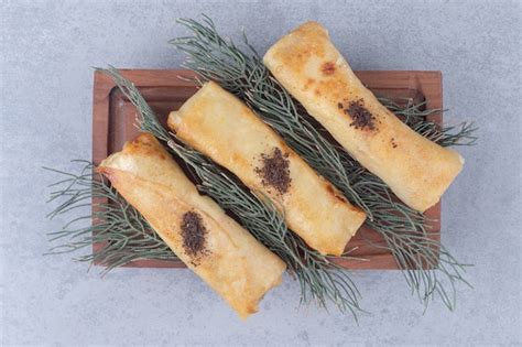 Free Photo | Serving of russian blins on a wooden platter, adorned with ...