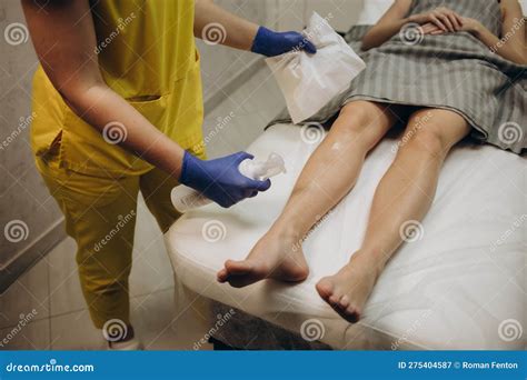 Beautician Waxing Female Legs in Spa Center. Stock Image - Image of ...
