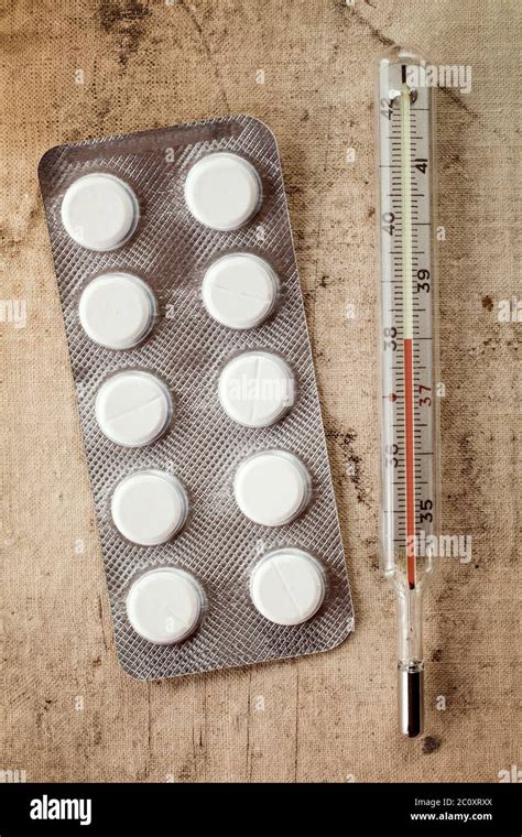 Medicaments with thermometer Stock Photo - Alamy