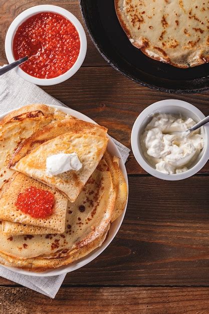 Premium Photo | Traditional Russian Crepes Blini stacked in plate and ...